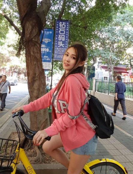 The girl with a yellow bicycle