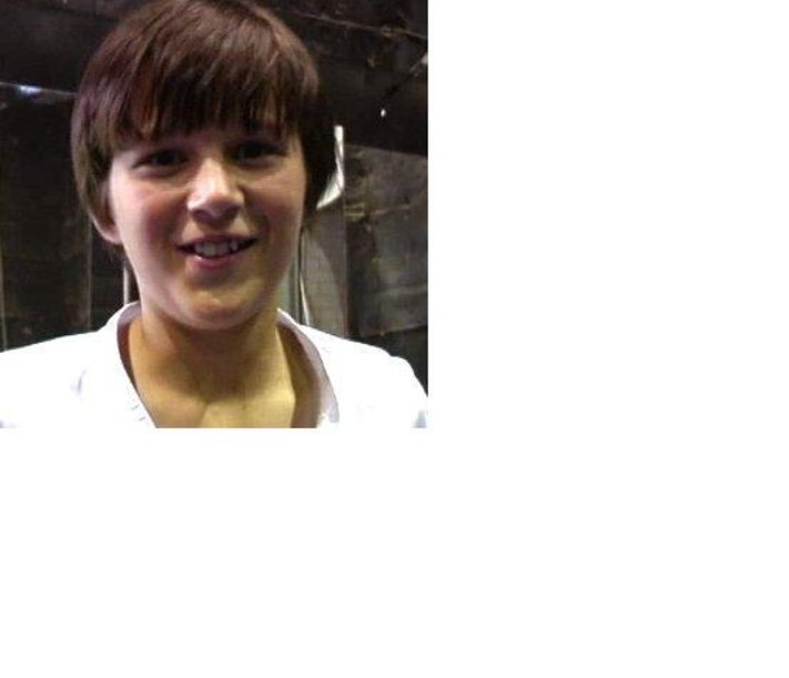 Harry Newell in his sandals in his house