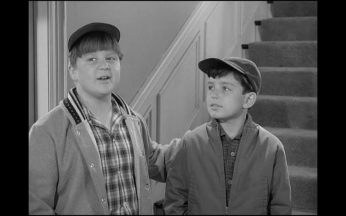 Rusty Stevens hugs Jerry Mathers telling Wally he'