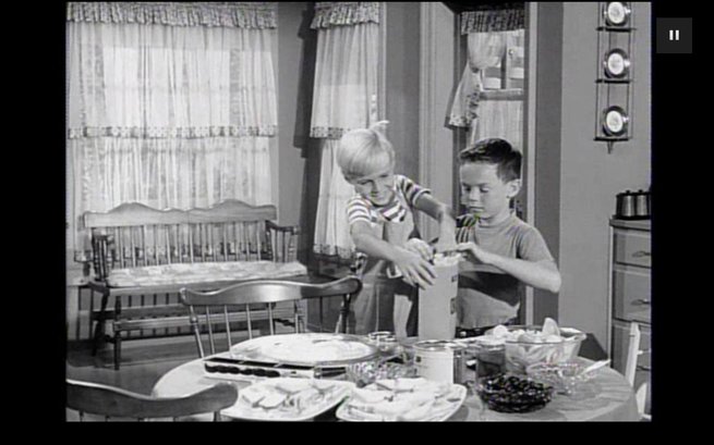 Jay North hugs Billy Booth while they take somethi